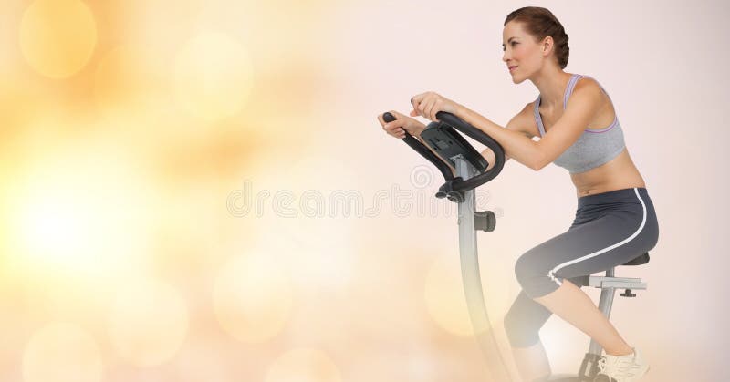 Woman riding exercise bike stock photo. Image of fitness - 92883168