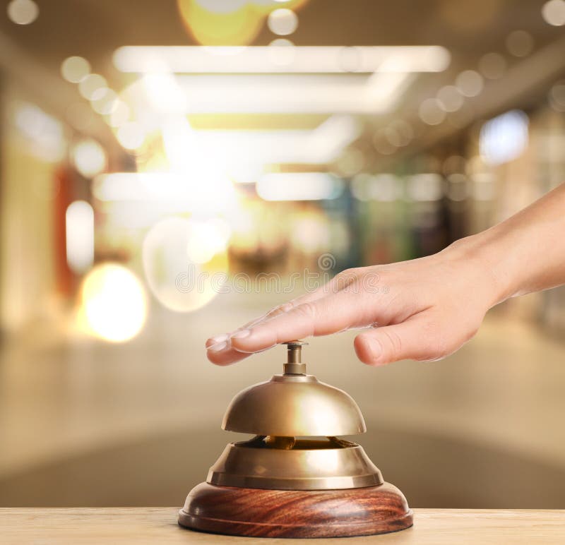 Woman Ringing Hotel Service Bell at Stone Table Stock Image - Image of ...