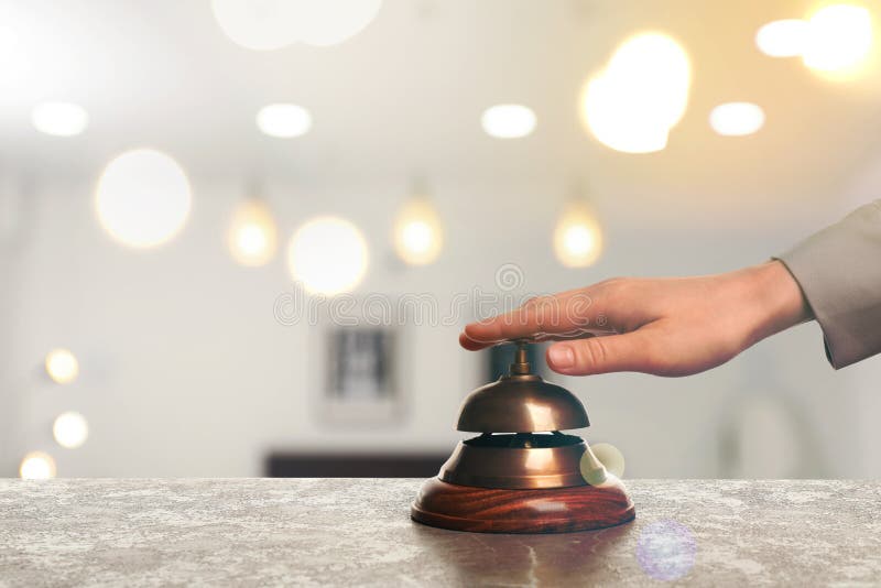 Woman Ringing Service Bell on Reception Desk in Hotel Stock Image ...