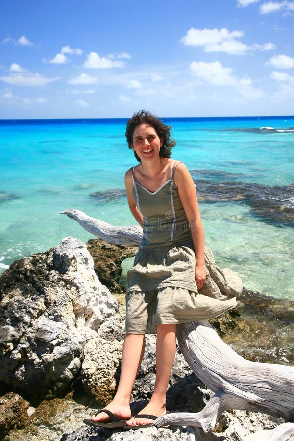 Woman on rocks stock image. Image of mother, exotic, island - 12603921