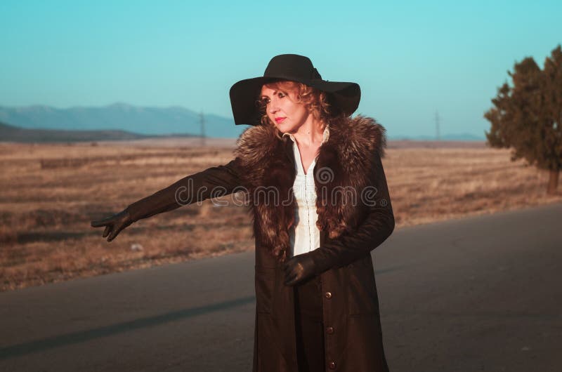 Woman on Rode Catching a Ride Stock Photo - Image of catching ...