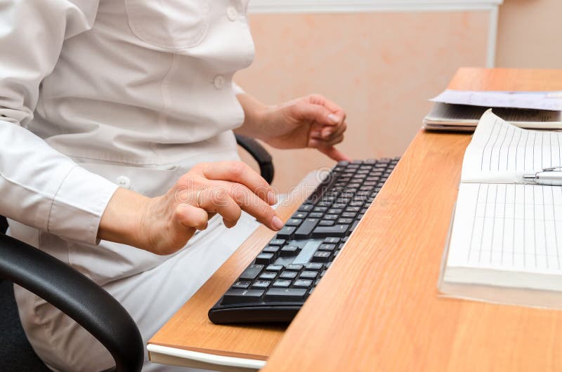 Woman Roentgenographer in Polyclinics Office Enters Data into Co Stock ...