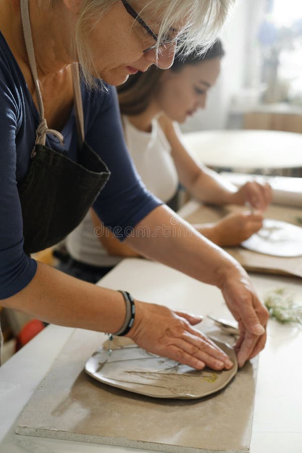 Woman Rolling Clay, Making Ceramic Plate in Studio Workshop Stock Image ...