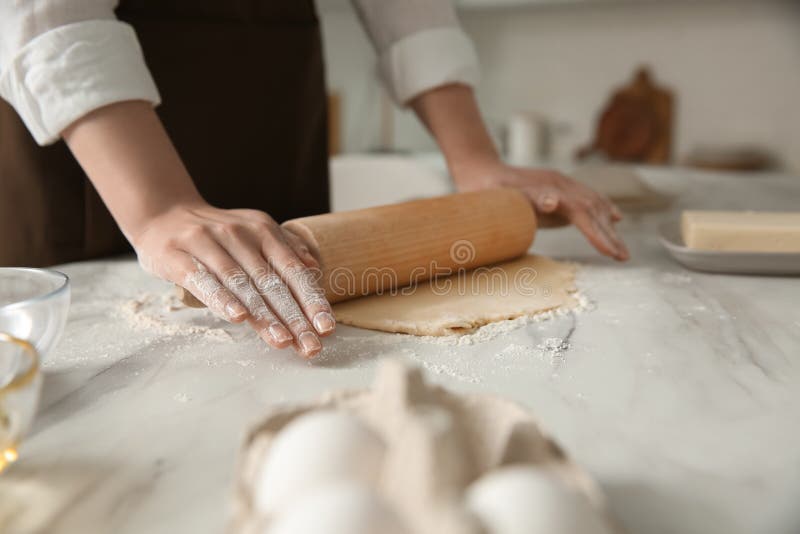 Woman Rolling Dough at Table in Kitchen, Closeup Stock Image - Image of ...