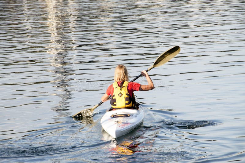 Woman Rowing Her White Kayak Editorial Stock Image - Image of evening ...