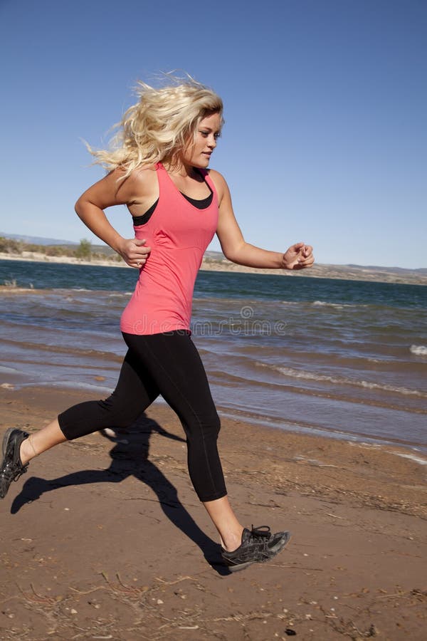 Woman running stock image. Image of marathon, female, people - 1100051