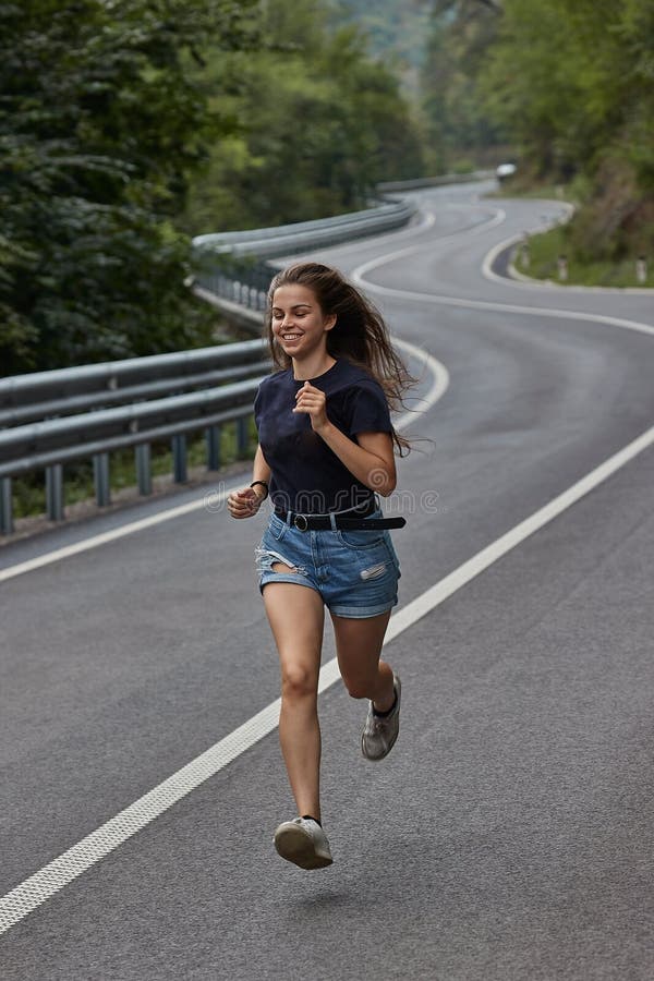 Woman Runing on a Bendy Road Stock Photo - Image of empty, mountain ...