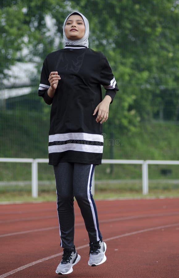 Woman Runner Doing Stretching Exercise, Preparing for Morning Workout ...