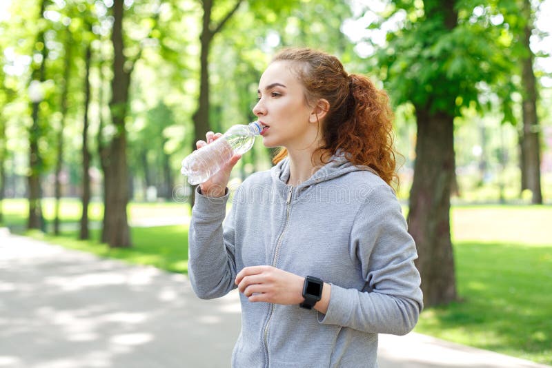Woman Runner is Having Break, Drinking Water Stock Image - Image of ...