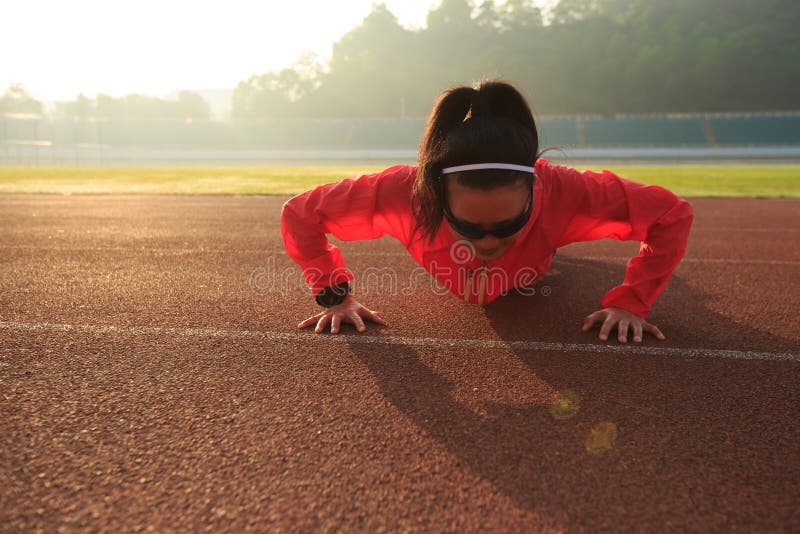 Woman Runner Practice Push Up on Stadium Track Stock Photo - Image of ...