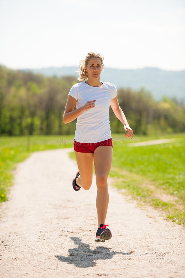 Woman Runner Runs - Workout in Spring Stock Photo - Image of jogger ...