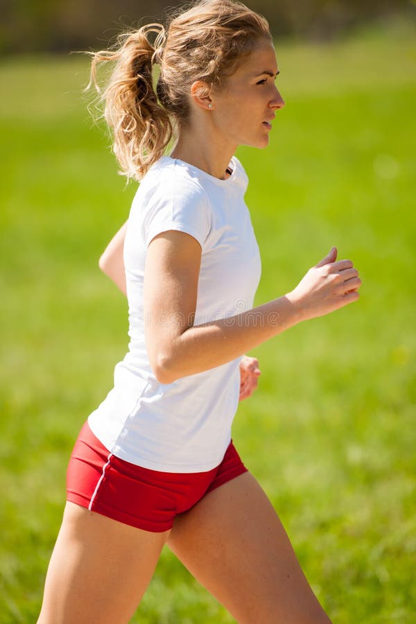 Woman Runner Runs - Workout in Spring Stock Photo - Image of rural ...