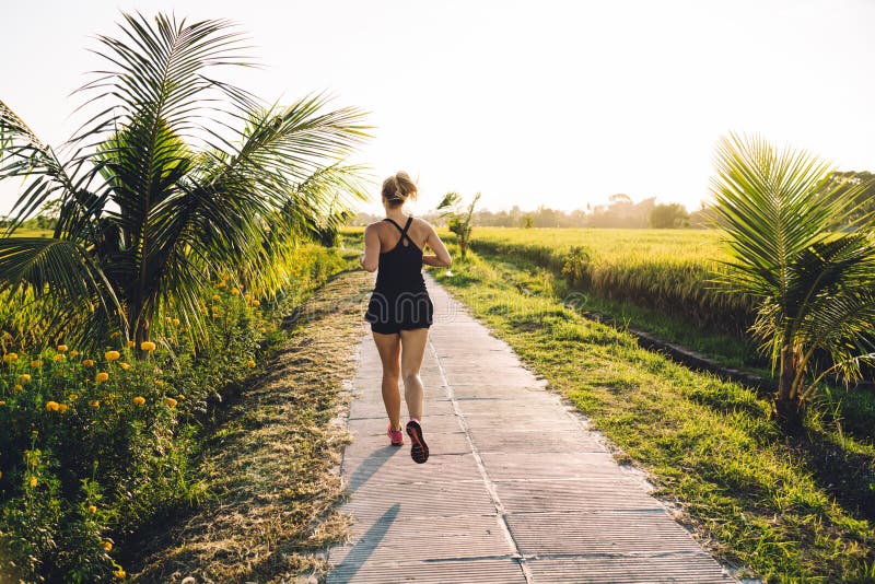 Woman Running Along Path among Rice Fields Stock Image - Image of green ...
