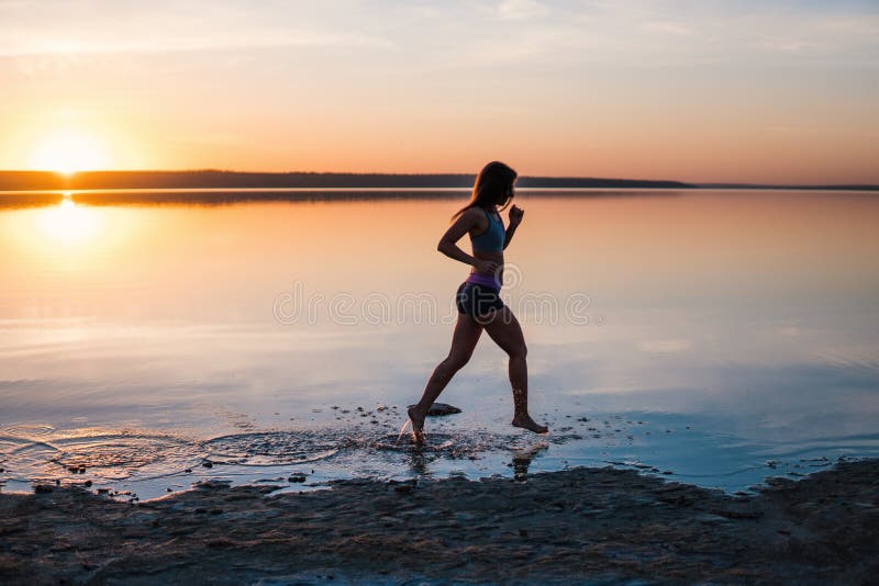 Woman Running on the Beach at Sunset Stock Image - Image of running ...