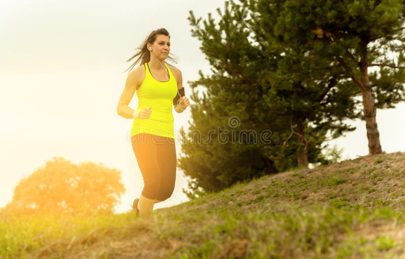 Woman Running in Countryside Stock Image - Image of happy, nature: 58949059