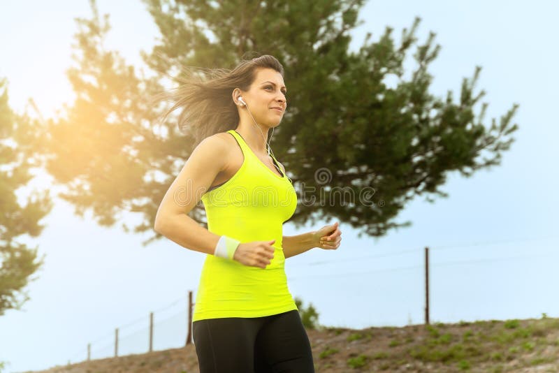 Woman Running in Countryside Stock Image - Image of happy, nature: 58949059