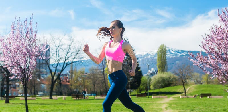 Woman Running Fast for Sport on Sunny Day Stock Image - Image of ...