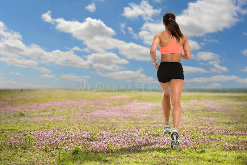 Woman Running on Field stock image. Image of healthy - 42659443