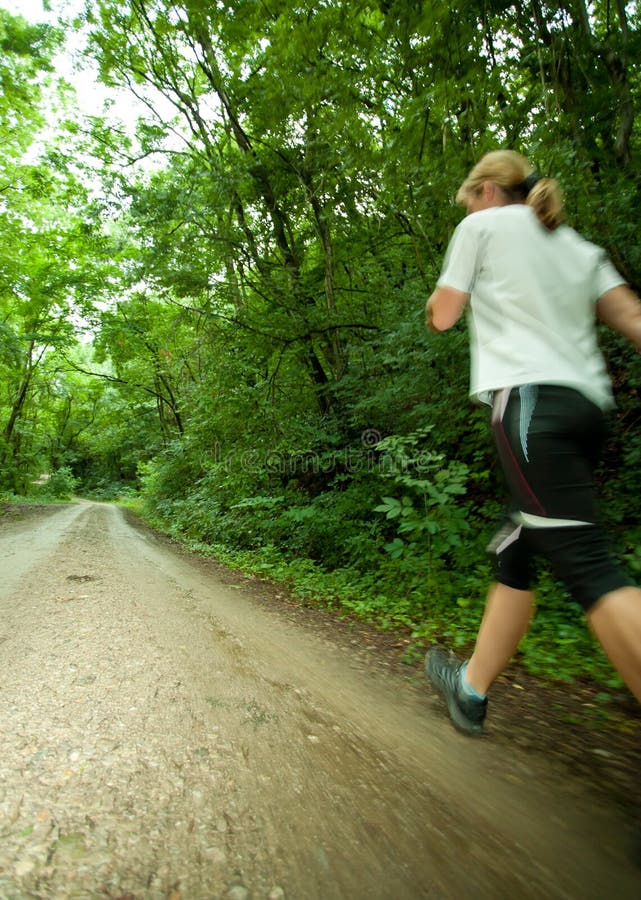 Woman running in forest stock photo. Image of beauty - 18249976