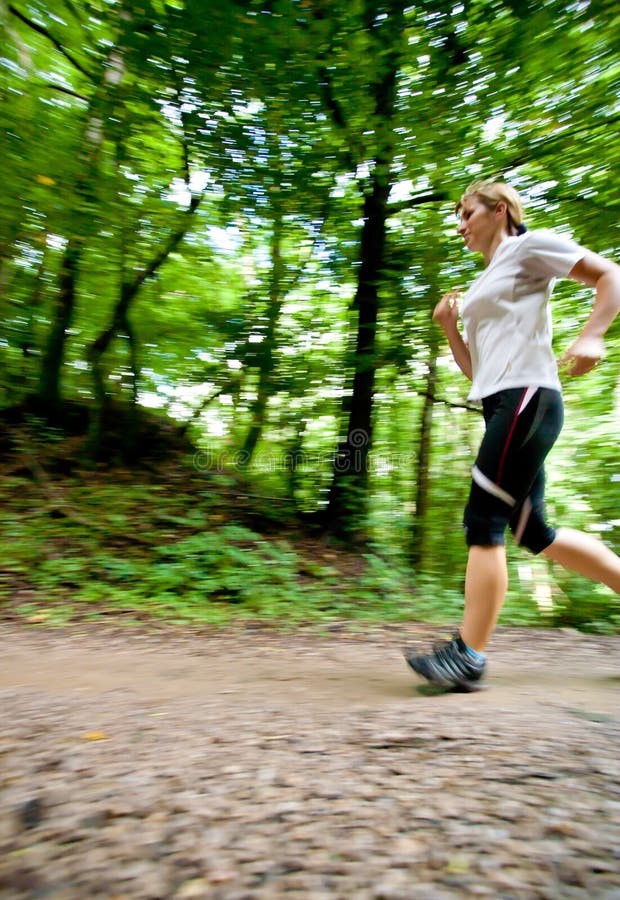 Woman running in forest stock image. Image of health - 18250365