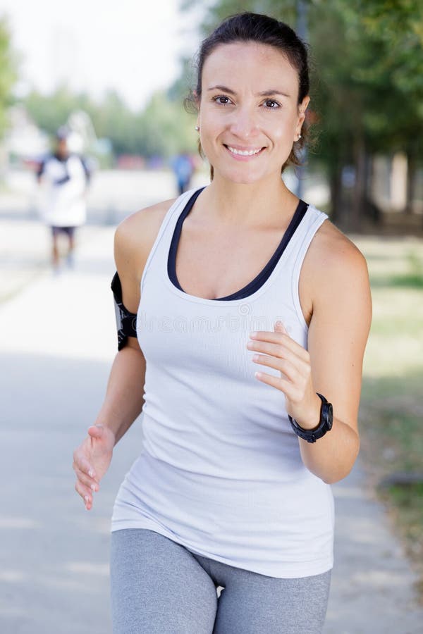 Woman running outdoors stock image. Image of athletic - 278504965