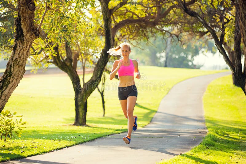 Woman running in the park stock image. Image of healthy - 37864413