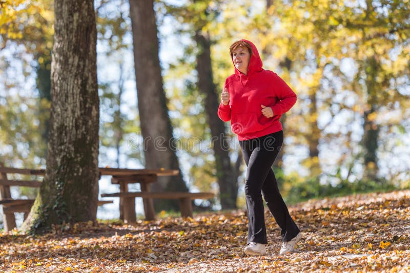 Woman running in park stock photo. Image of running, adult - 61841718