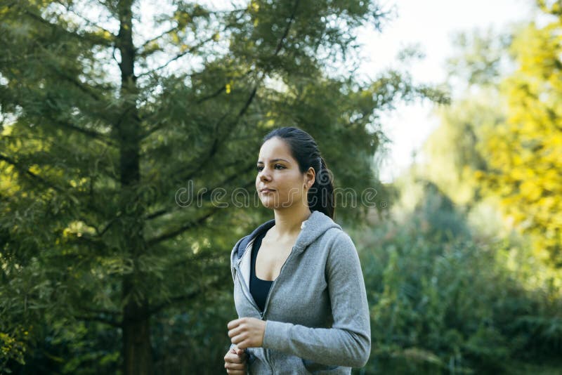 Woman running in park stock photo. Image of adult, athletic - 64783358
