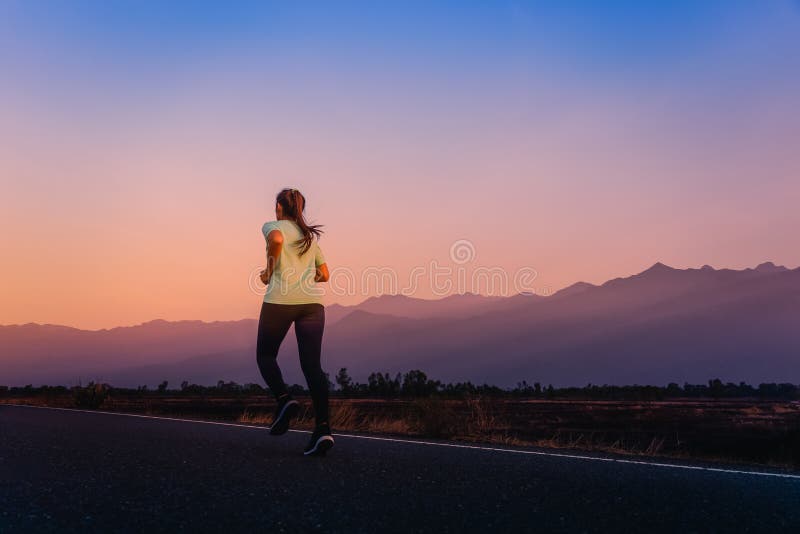 Woman Running on Road with View of Mountains in the Morning Stock Image ...