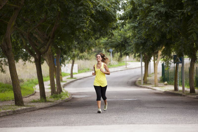 Woman Running at the Street Stock Photo - Image of energy, jogger: 48829428