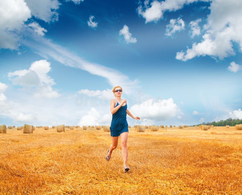 Woman Running through Summer Harvested Field Stock Image - Image of ...