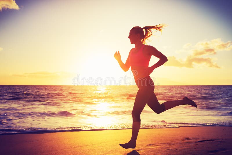 Woman running at sunset stock photo. Image of athlete - 43952722