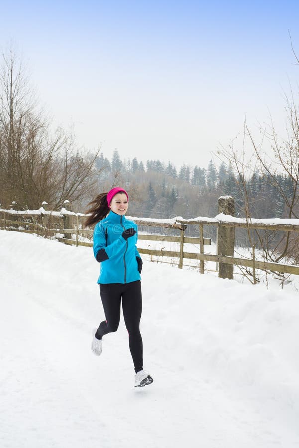 Woman running in winter stock image. Image of athlete - 28938317