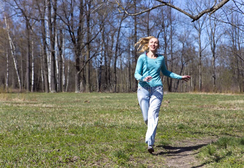 The Woman Runs on the Track in the Spring Wood Stock Image - Image of ...