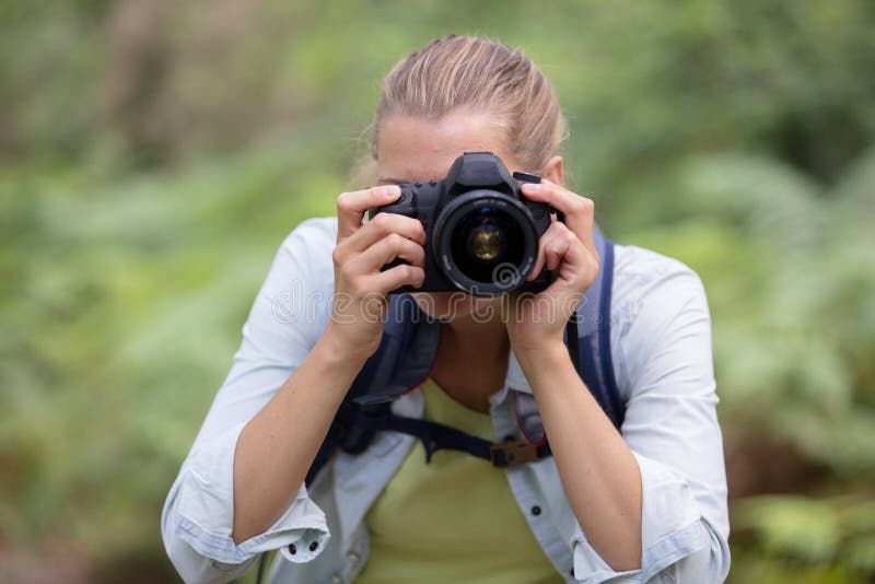 Woman in Rural Setting Looking through Camera Viewfinder Stock Image ...