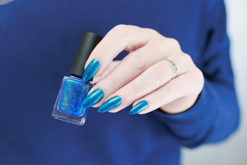 Woman S Beautiful Hand With Long Nails And Blue And Green Nail Polish