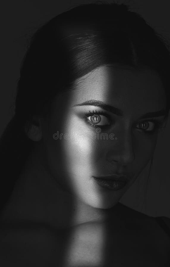 Woman S Face Illuminated by Light in the Dark Stock Photo - Image of ...