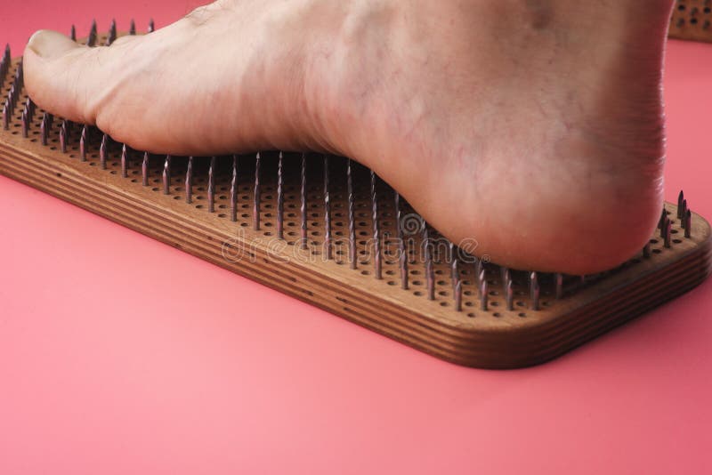 Woman S Feet Stand on a Board with Nails Stock Photo - Image of ...