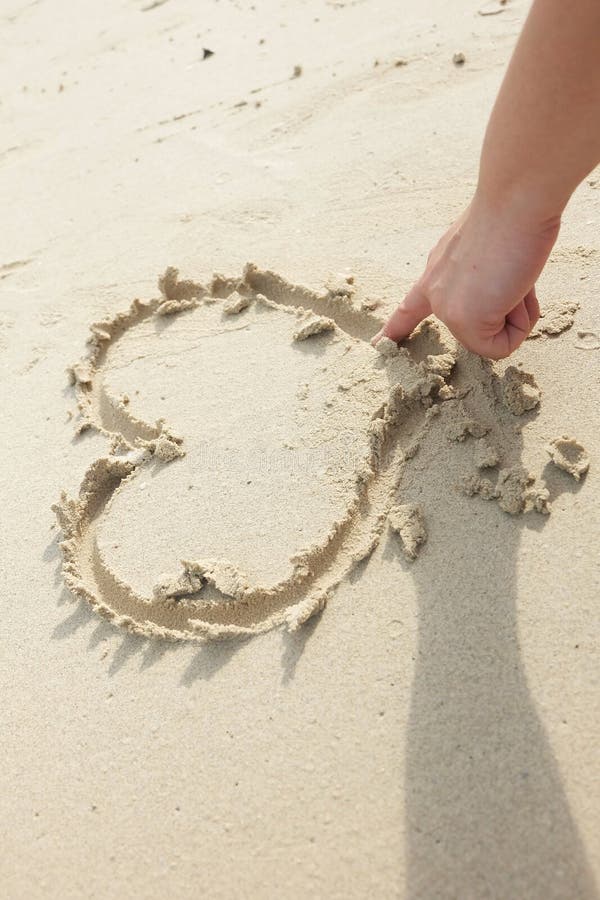 Woman`s Finger Drawn Heart Shape on the Sand Stock Image - Image of ...