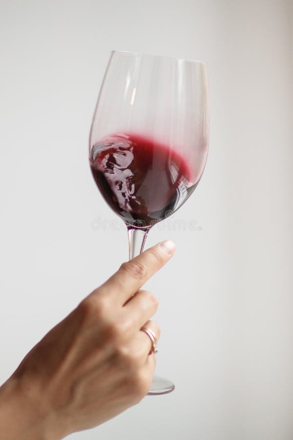Woman`s Hand Holding Glass with Red Wine Stock Image - Image of adult ...
