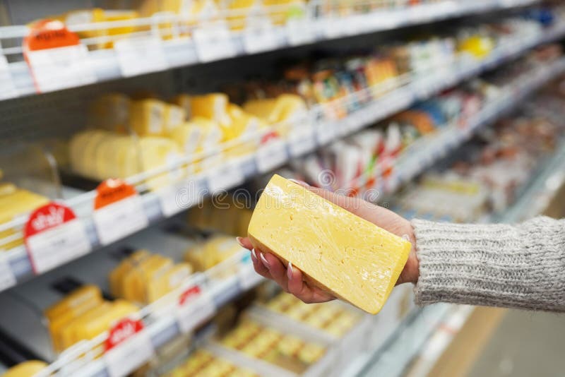 Woman`s Hand with Cheese in Grocery Store Stock Image - Image of ...