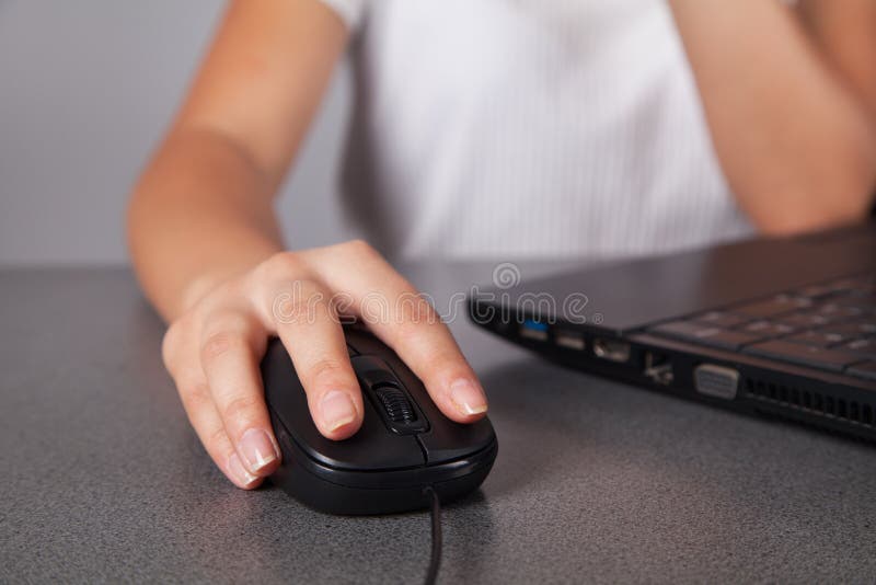 Woman`s Hand with Computer Mouse on Table. Black Computer Stock Image ...
