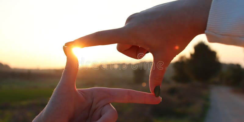 Woman& X27;s Hand Creates a Frame in Front of the Sun. Idea of Vision ...