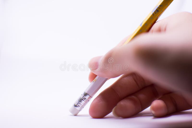 Pencil Erasing on White Paper Stock Photo - Image of eraser, particle ...