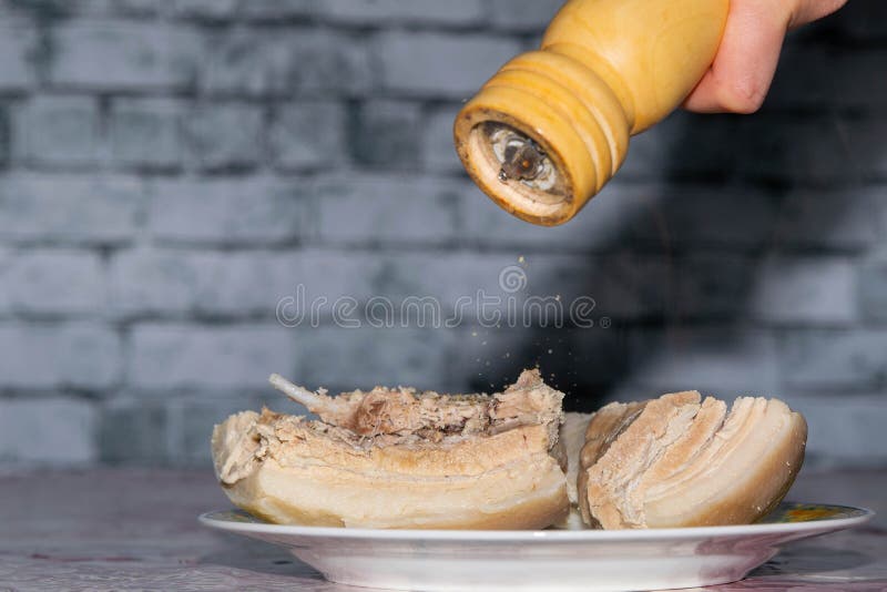 Woman& X27;s Hand Flavors Bacon with Pepper Stock Photo - Image of ...