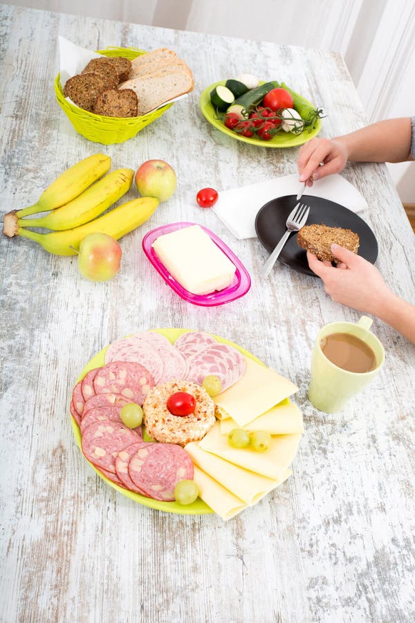 A woman s hand with food stock image. Image of buttering - 74619641