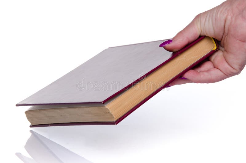 Woman s hand giving a book stock photo. Image of education - 40351014
