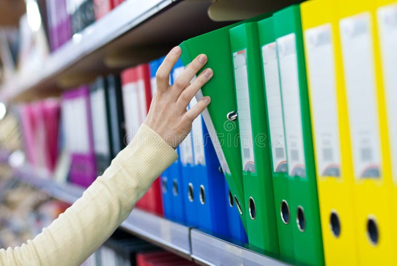 Girl S Hand Taking Big Folder from the Shelves with Office Files. Stock ...