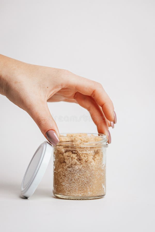 Woman S Hand Holding a Jar of Body Scrub Stock Image - Image of ...