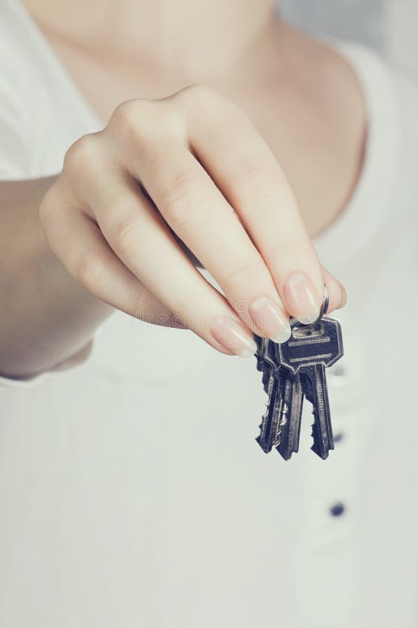 Woman S Hand Holding New Keys Stock Photo - Image of modern, metallic ...